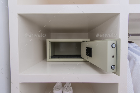 Safety box with electronic lock at hotel Stock Photo by romankosolapov