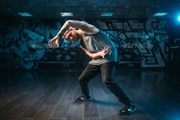 Breakdance performer posing in dance studio Stock Photo by NomadSoul1