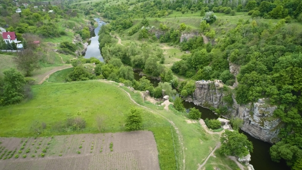 Aerial Footage. Fly Above Village and River Canyon Buki, Stock Footage