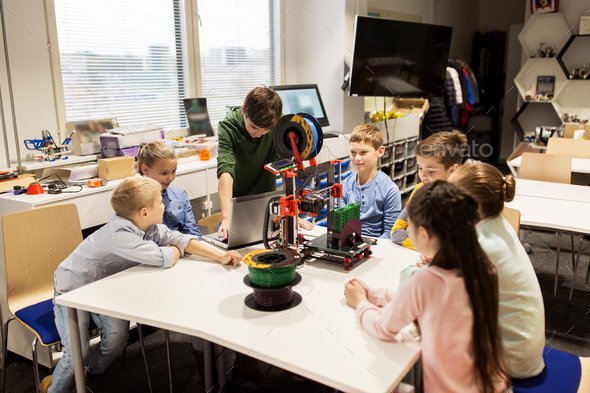 happy children with 3d printer at robotics school Stock Photo by dolgachov