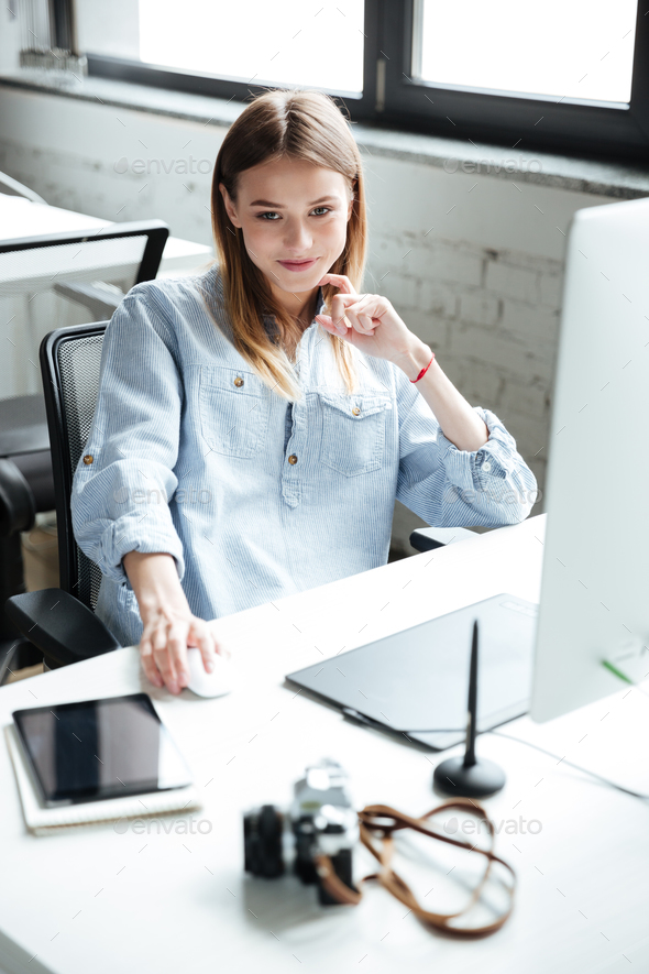 Pretty young woman work in office using computer Stock Photo by ...