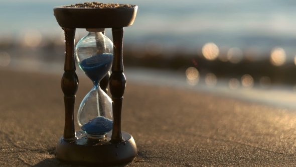 Hourglass on the Beach Sand Beach. Daylight Saving Time Concept, Stock ...