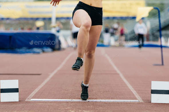Girl Athlete Long Jump Stock Photo by realsportsphotos | PhotoDune