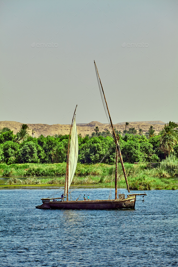 Traditional Boat on the Nile River in Egypt Stock Photo by EwaStudio