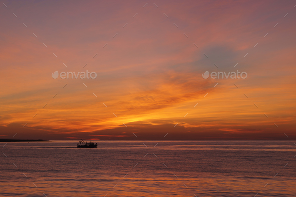 Small fishing boat in the sea at sunset Stock Photo by Aleks_Sg | PhotoDune