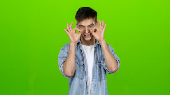 Male Actor Smiles, Showing Them Different Grimaces and Language. Green ...