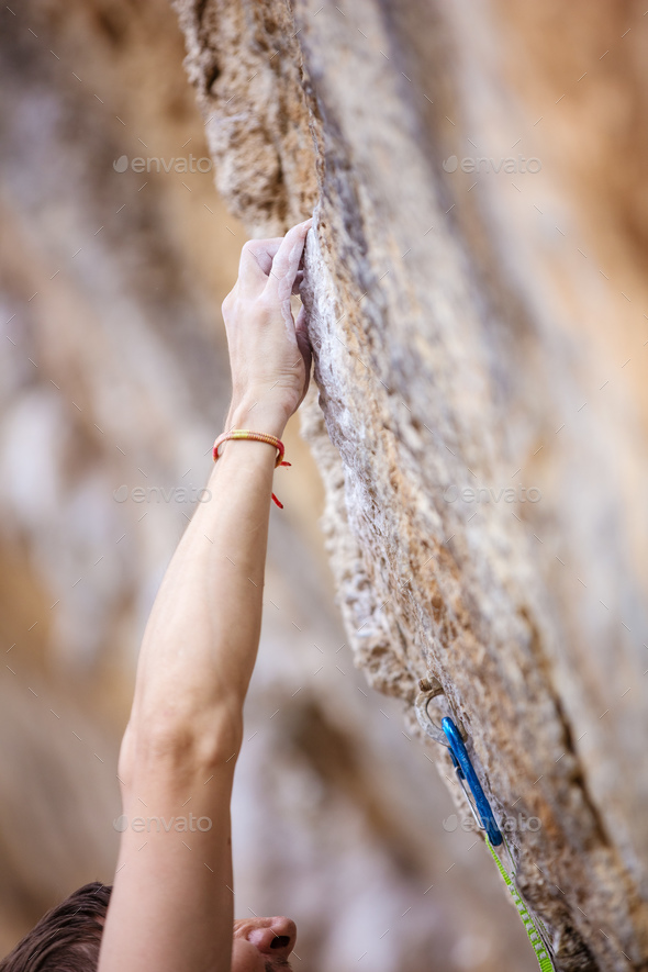 Cropped view of climber's hand on cliff Stock Photo by photobac | PhotoDune