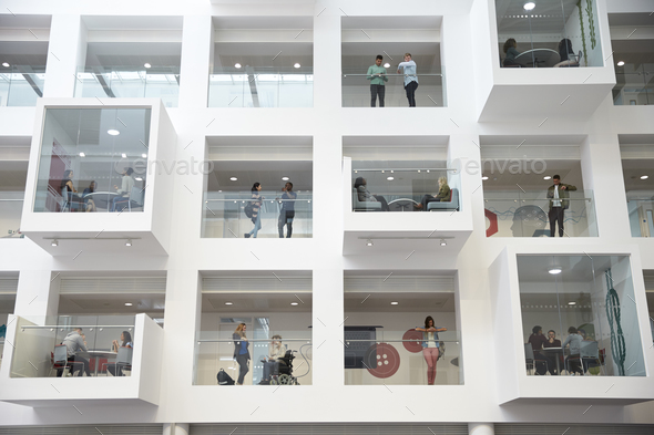 Students in study rooms, visible from the university lobby Stock Photo ...