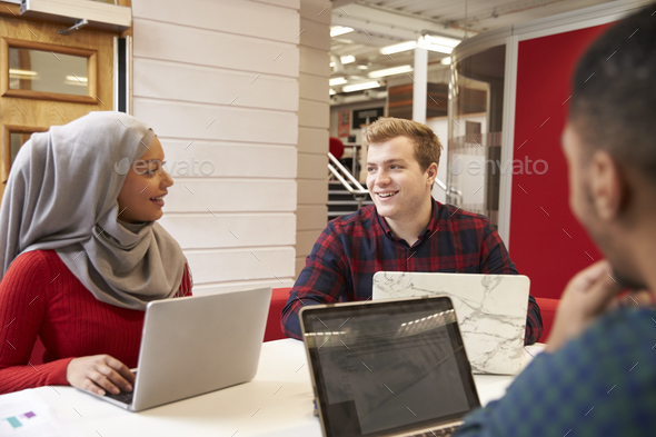 Group Of University Students Collaborating On Project Stock Photo by ...