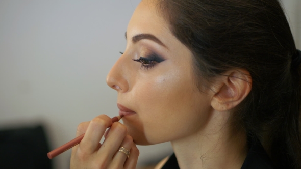 Makeup Artist Makes Models Eye Makeup. Beautiful Woman Applying ...