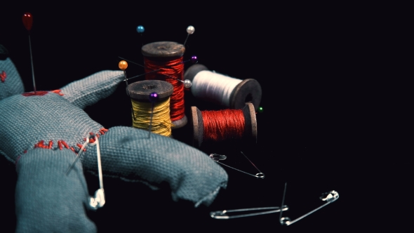 Stitched Voodoo Doll for Ritual on a Black Background with Threads and ...