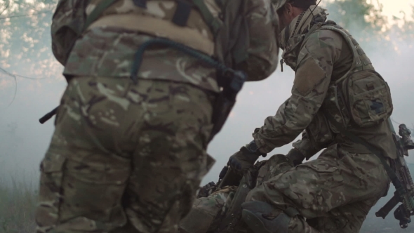 Soldiers Helping Injured Fellow, Stock Footage | VideoHive