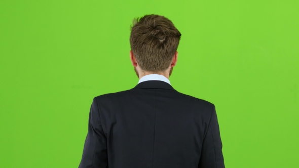 Businessman Is Going To a Meeting and Waving Greetings. Green Screen ...