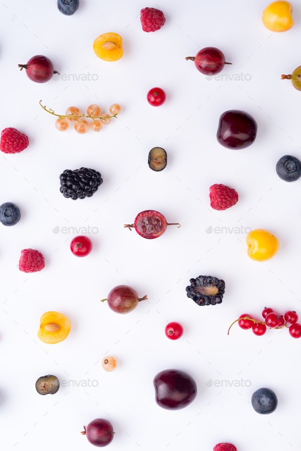Mix of berries isolated over white background table. Stock Photo by ...