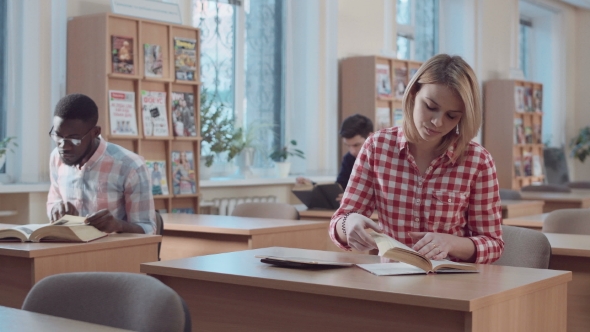 Girl Student Working with Book and Tablet, Stock Footage | VideoHive