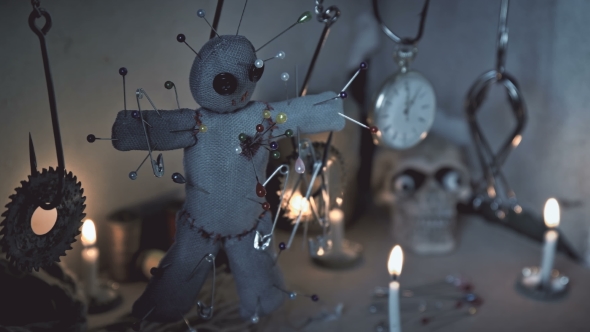 the Voodoo Doll Swinging on the Hook Over the Ritual Table, Stock Footage