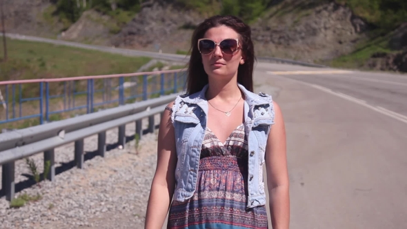 Portrait. A Beautiful Girl Walks Along the Road and Turns To Look at ...