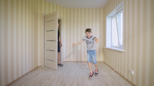 Happy Family Walking in New House. Joyful Boy Opening Door Entering His ...