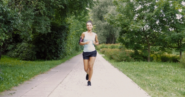Cheerful Woman Running in Park, Stock Footage | VideoHive