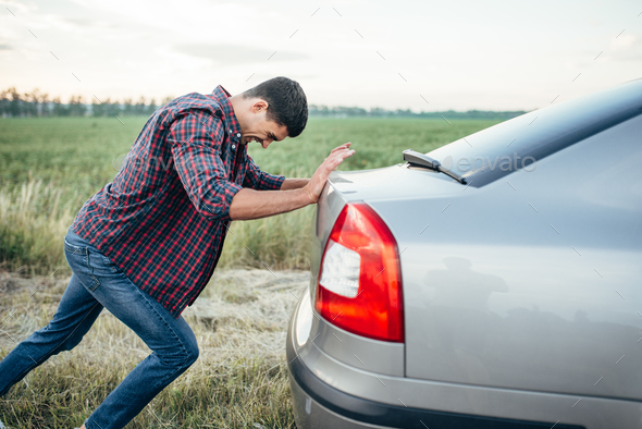 Man pushing broken car, side view Stock Photo by NomadSoul1 | PhotoDune