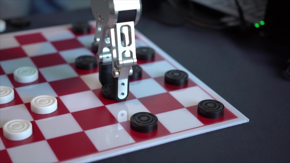 Robot Playing Checkers. Hand Manipulator Moves Checkers., Stock Footage