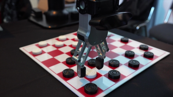 Robot Playing Checkers. Hand Manipulator Moves Checkers., Stock Footage