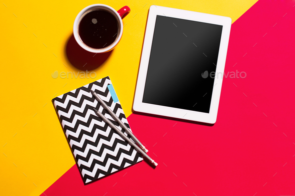 Modern red office desk table with smartphone and cup of coffee. Stock ...