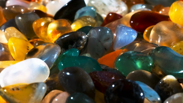 Multi-colored Gems Sparkle on a Revolving Background, Stock Footage