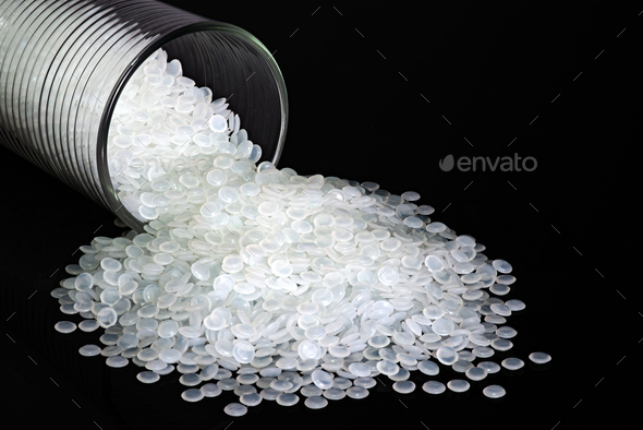 Industrial white plastic beads, granules on black background. Stock ...