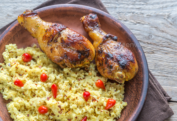 Spicy chicken drumsticks with rice curry Stock Photo by Alex9500 ...