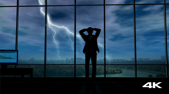 A Businessman Holds His Head When Thunder Clouds Gather Around Him ...