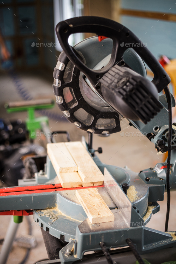 Miter Saw on a construction site Stock Photo by aetb | PhotoDune