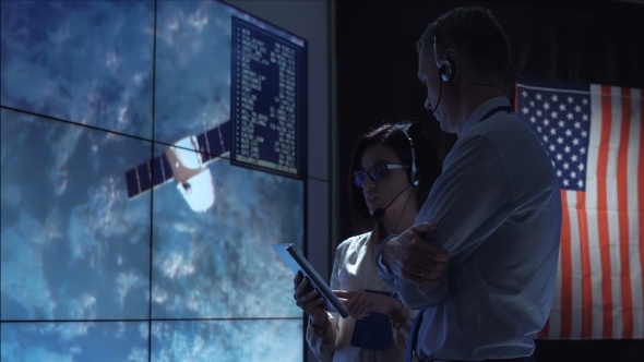 People Communicating in Space Flight Center, Stock Footage | VideoHive