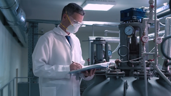 Man in Mask Holding the Notepad, Stock Footage | VideoHive