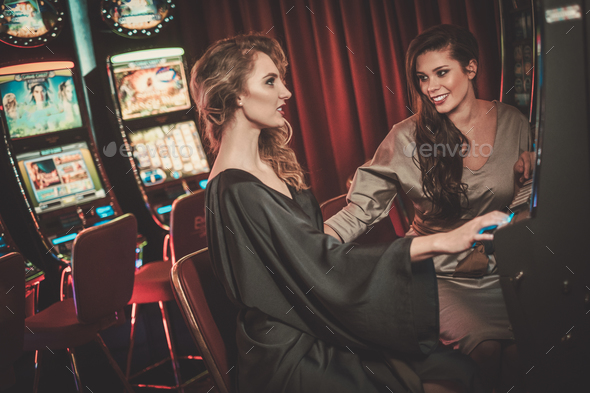 Beautiful women near slots machines in a luxury casino interior Stock ...