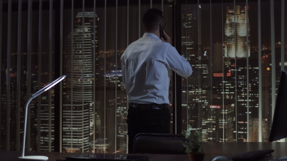 Man in Office Talking Phone at Night, Stock Footage | VideoHive
