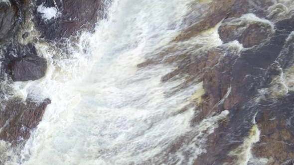 Rising Aerial Shot Looking Down at Raging Waterfall in a River, Stock ...