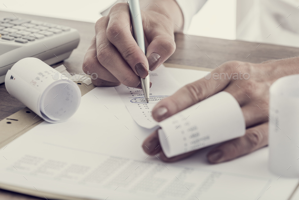 Accountant working at her desk Stock Photo by Gajus-Images | PhotoDune