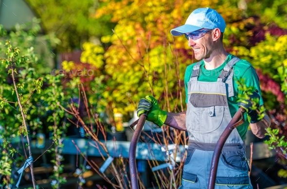 Happy Landscaping Worker Stock Photo by duallogic | PhotoDune