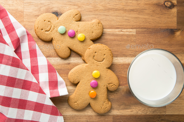 Sweet gingerbread man and glass of milk. Stock Photo by jirkaejc ...
