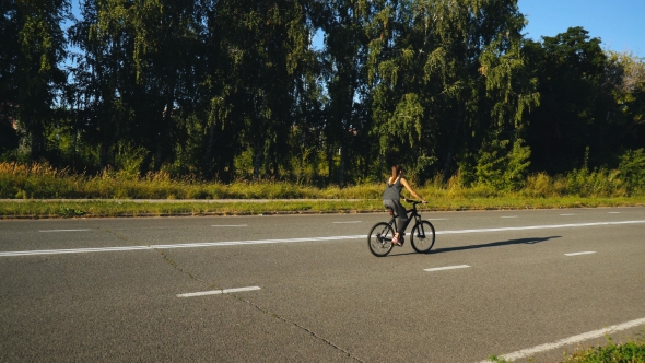 Woman Cycling Alone Riding Bike at Countryside, Spending Her Active ...