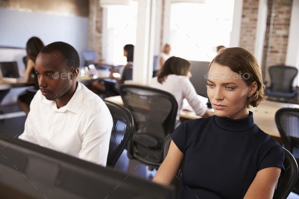 Businesspeople Working At Computers In Busy Modern Office Stock Photo ...