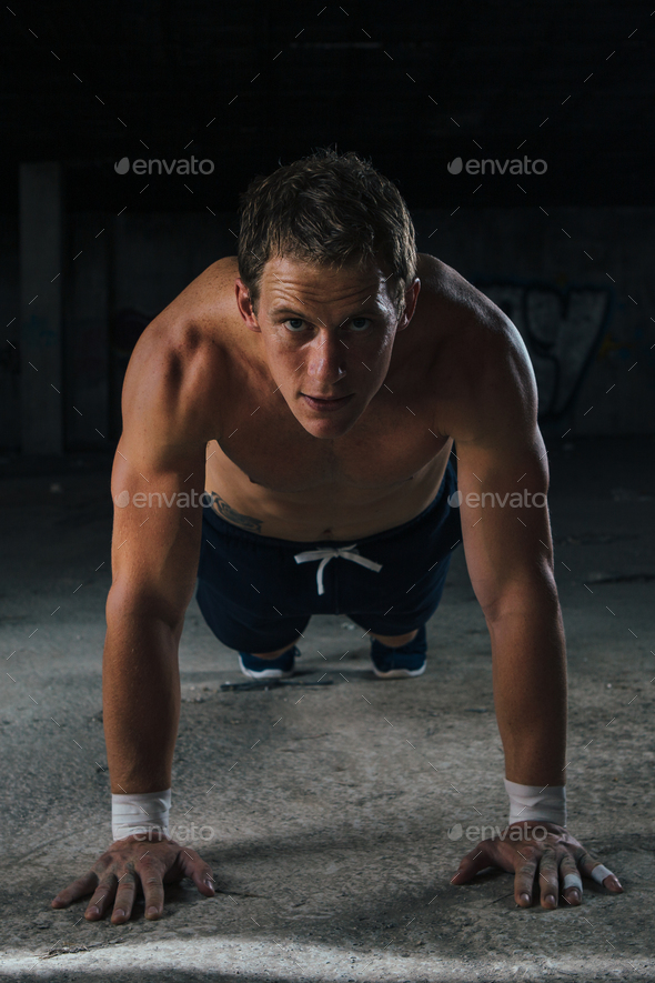 Muscle man pushing up Stock Photo by Click_and_Photo | PhotoDune