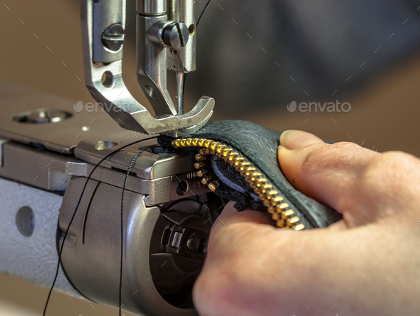 Industrial Sewing machine operated in workshop Stock Photo by ...