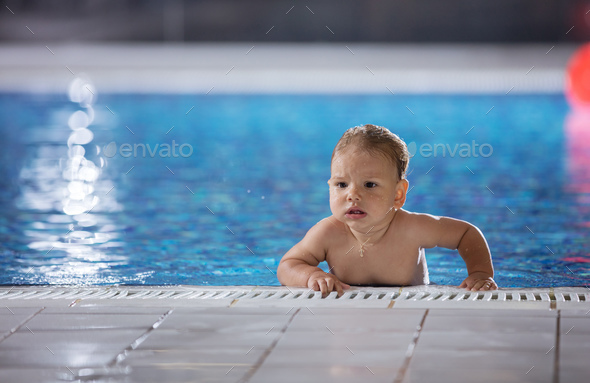 Little boy in indoor swimming pool Stock Photo by photobac | PhotoDune