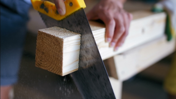 The Man Is Cutting Off a Piece of Wood , Stock Footage | VideoHive