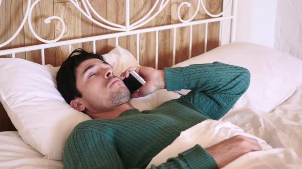 Man in Bed Dialing Call and Talking on Phone, Stock Footage | VideoHive