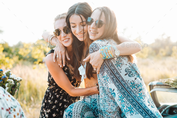 Three young girls posing on camera Stock Photo by simbiothy | PhotoDune