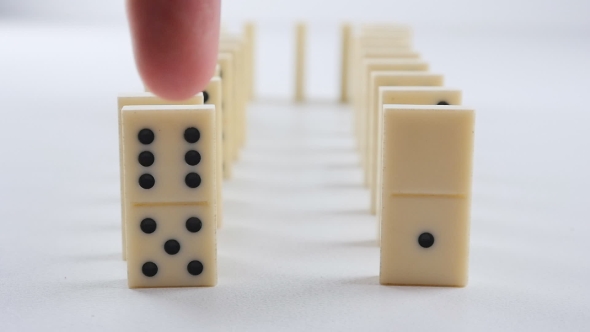 White Dominoes Falling in Chain Reaction. Domino Effect, Stock Footage