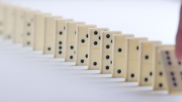 White Dominoes Falling in Chain Reaction. Domino Effect, Stock Footage